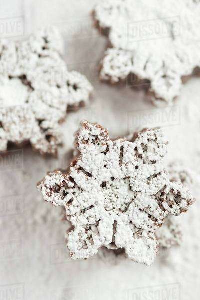 Mini snowflake-shaped chocolate cakes dusted with icing sugar - Royalty ...