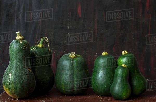 A row of green squash - Royalty-free Stock Photo | Dissolve