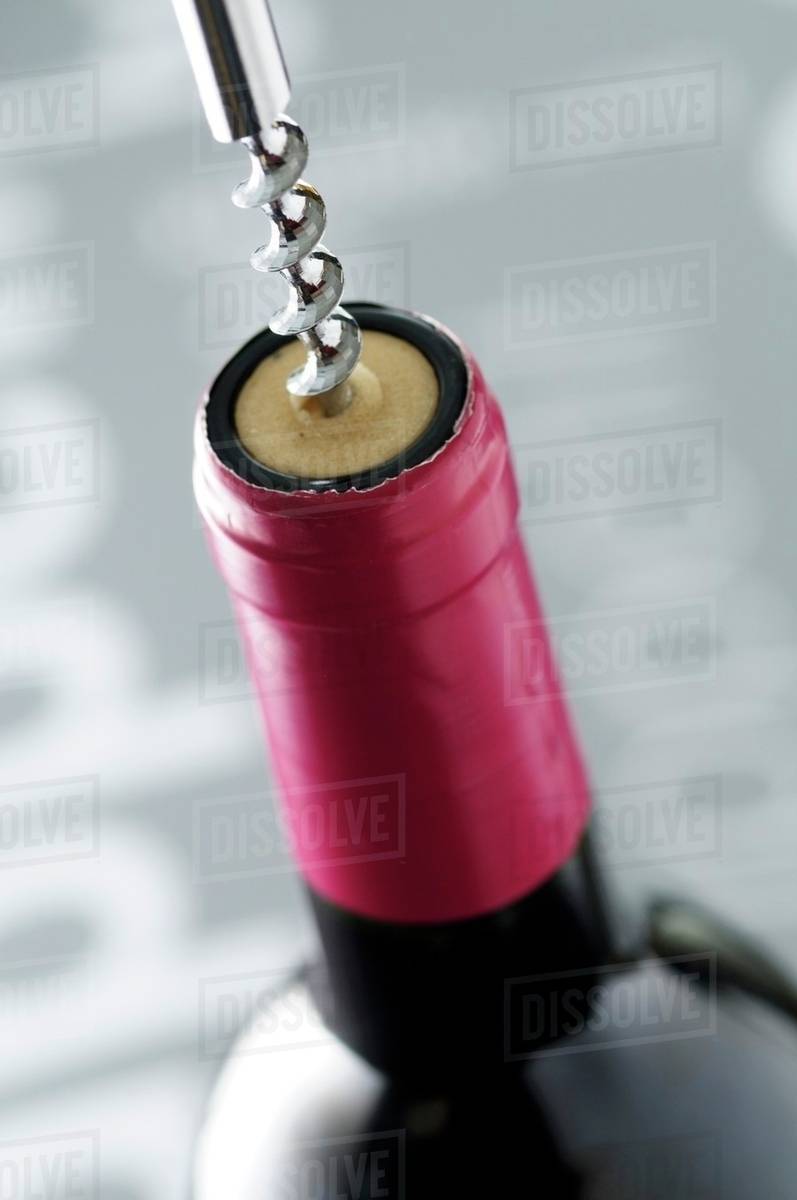Uncorking a bottle of red wine - Royalty-free Stock Photo | Dissolve