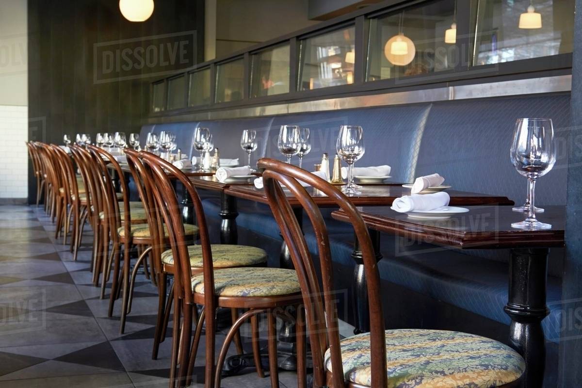 A long row of tables laid in a restaurant - Royalty-free Stock Photo ...