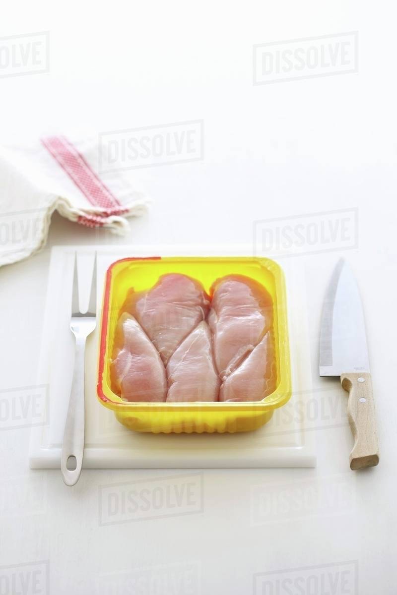 Fresh chicken breasts in an open plastic packet - Royalty-free Stock ...