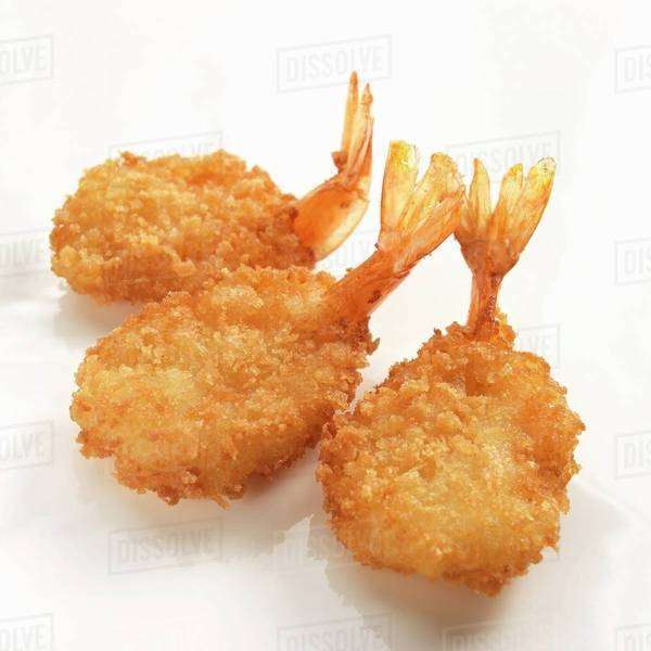 Three breaded fried prawns - Stock Photo - Dissolve