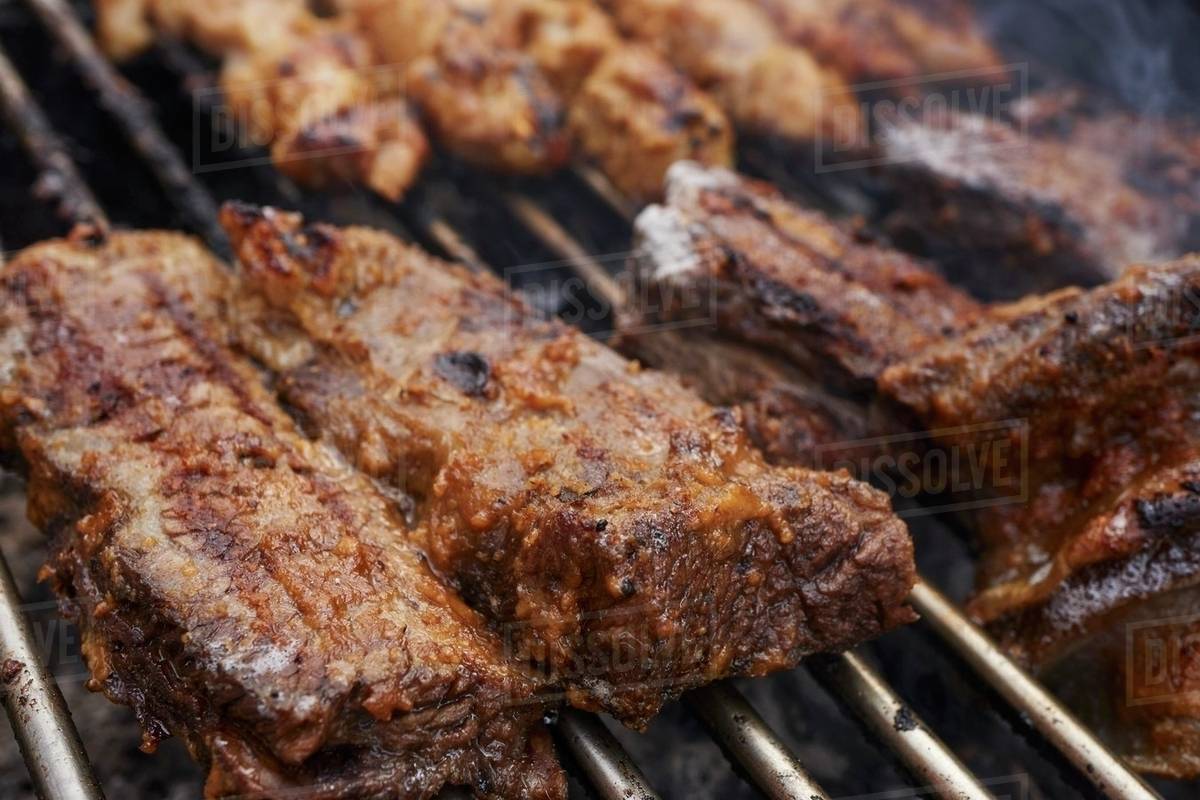 Indonesian style grilled beef on a barbecue - Royalty-free Stock Photo ...