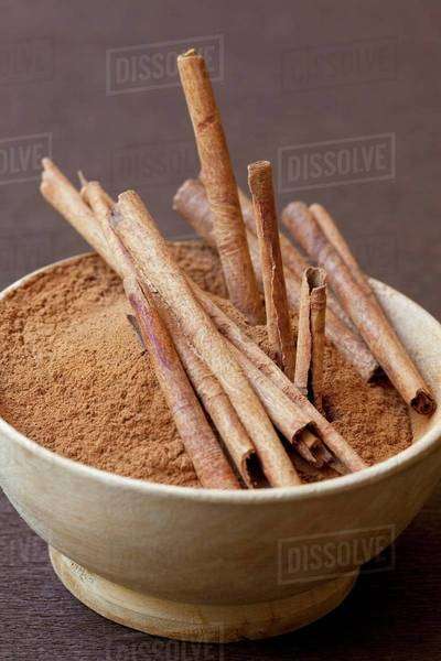 Ground cinnamon and cinnamon sticks - Royalty-free Stock Photo | Dissolve