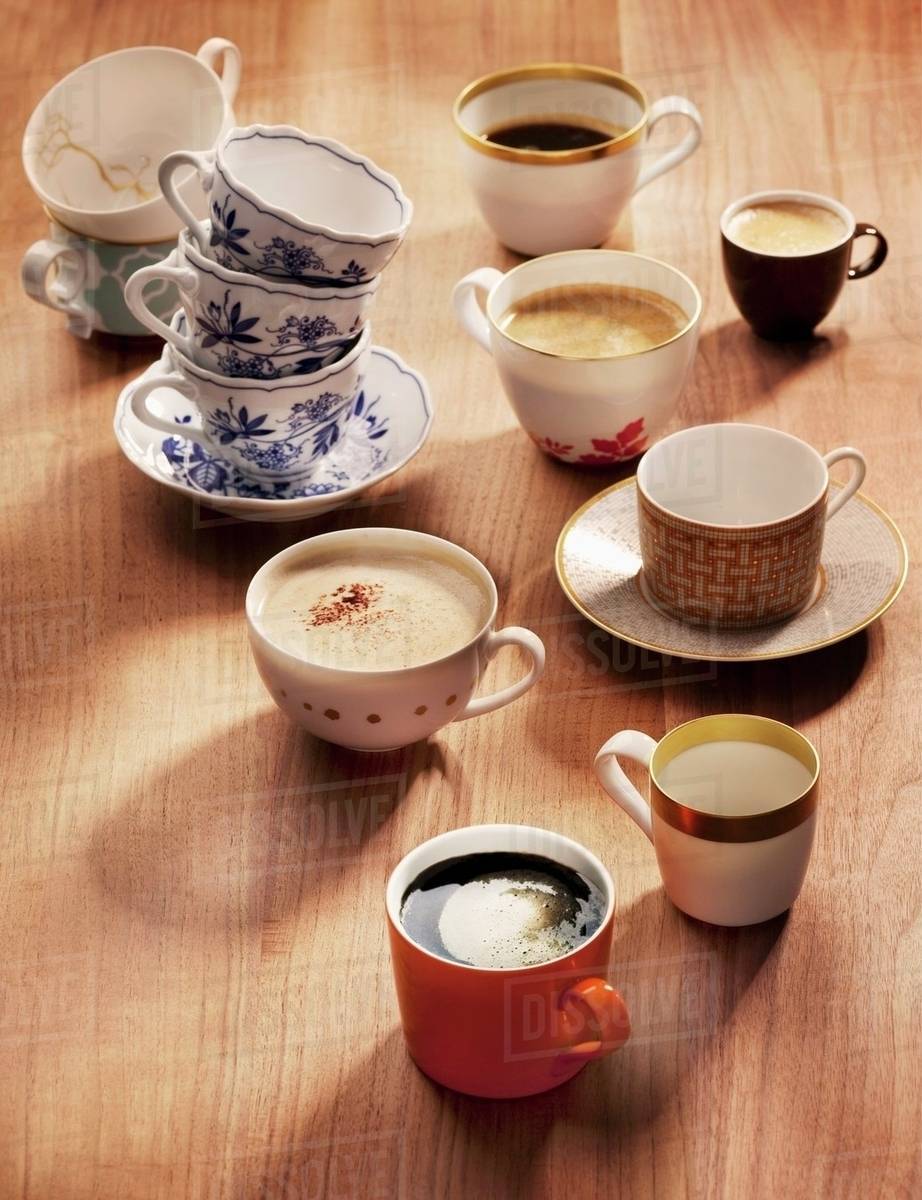 An assortment of coffee cups and varieties of coffee - Stock Photo ...
