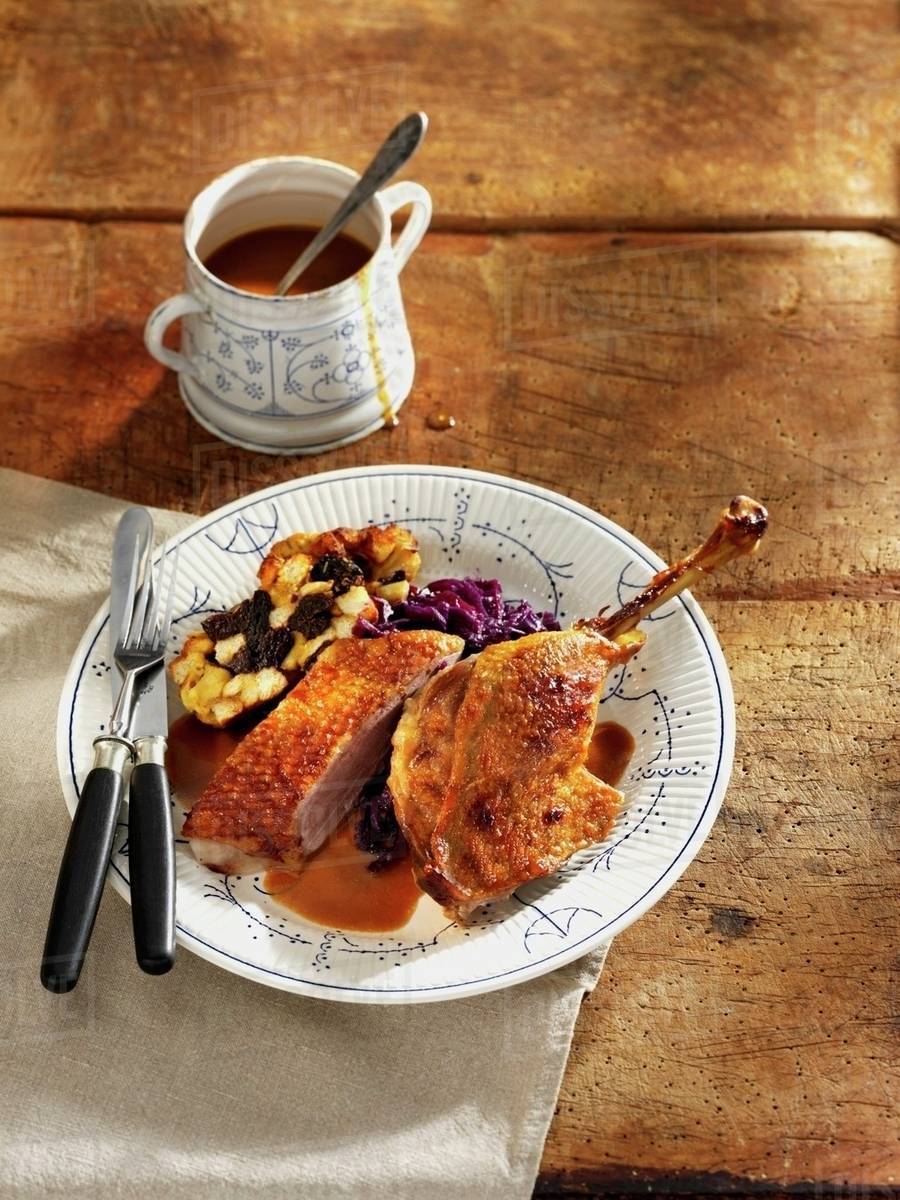 Traditional roast duck with red cabbage and stuffing - Royalty-free ...