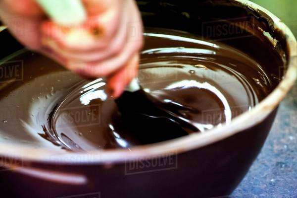 Melted chocolate being stirred - Royalty-free Stock Photo | Dissolve