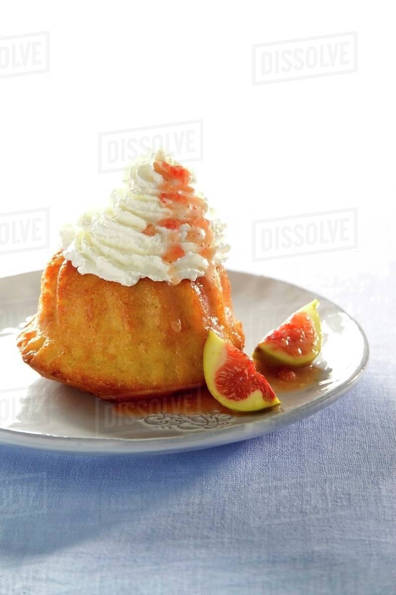 Rum baba with cream and figs - Royalty-free Stock Photo | Dissolve