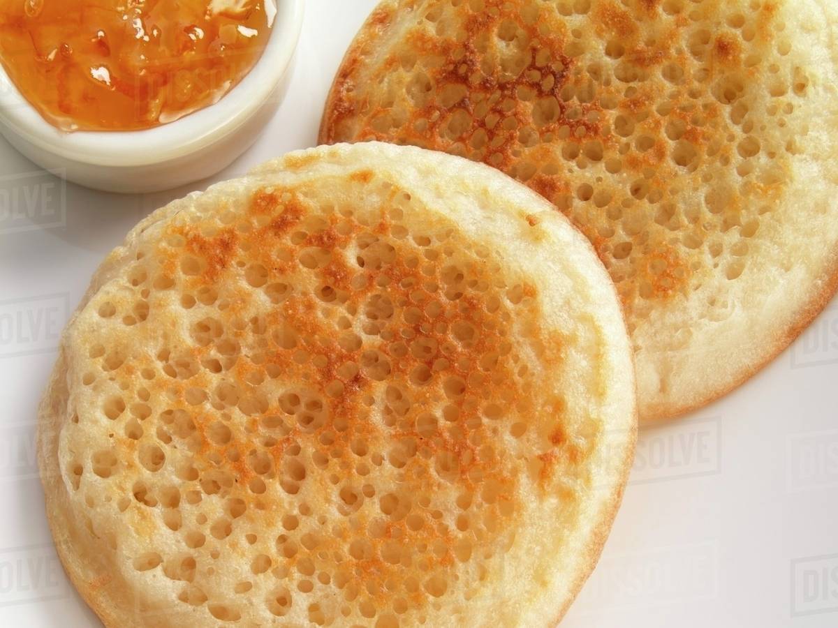Crumpets with Marmalade; Close Up - Stock Photo - Dissolve