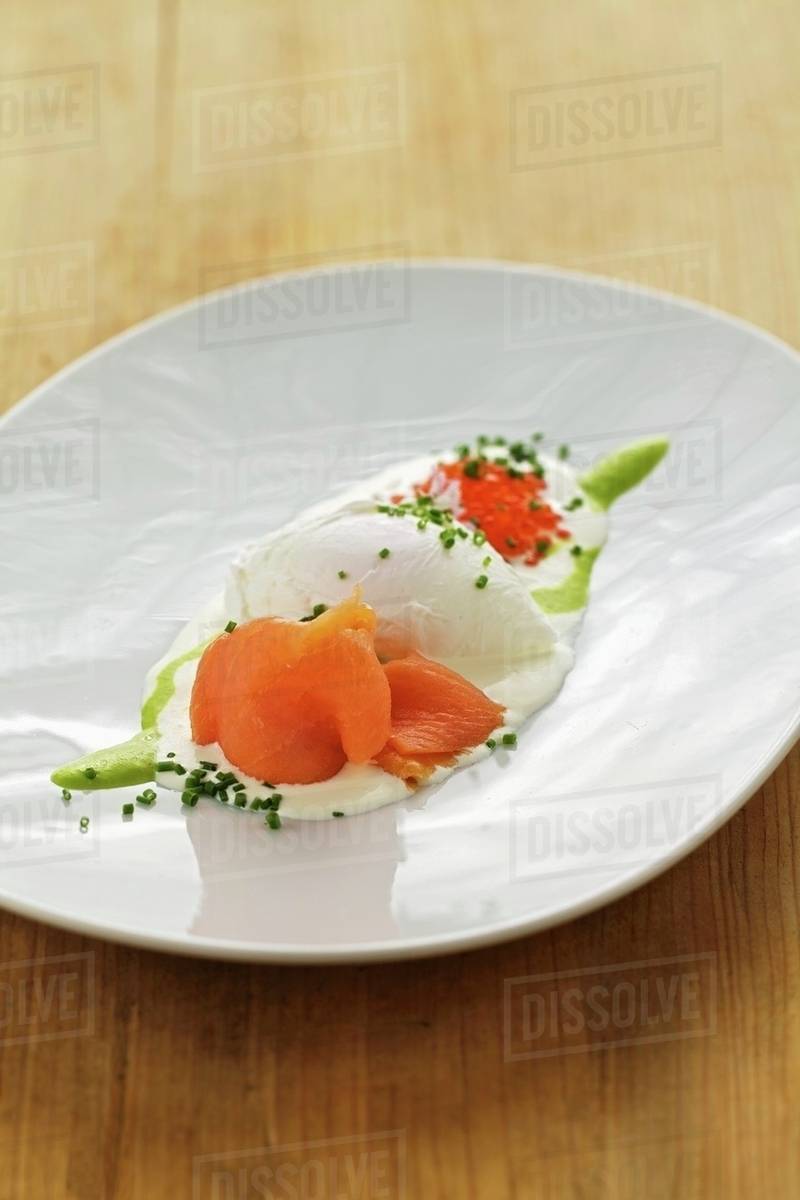 Soft-boiled egg with smoked salmon and char caviar - Stock Photo - Dissolve