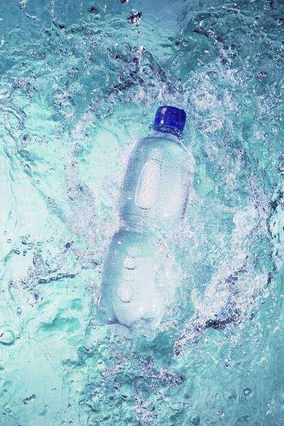 A bottle falling into water - Royalty-free Stock Photo | Dissolve