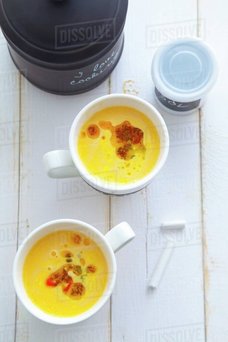 Carrot soup with olive oil - Stock Photo - Dissolve