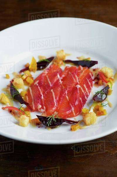Cured trout fillet with croutons and beetroot - Stock Photo - Dissolve