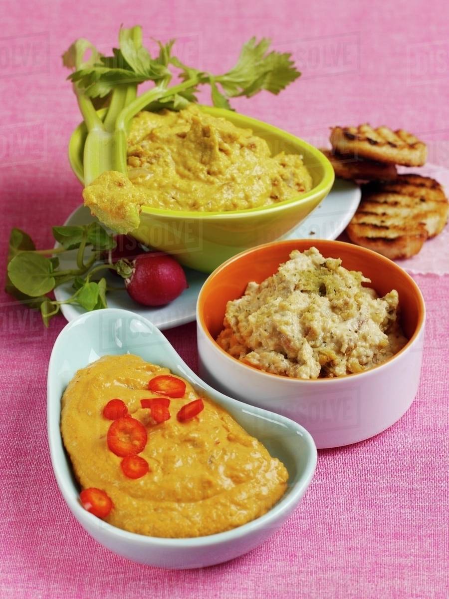 Three Bowls of Assorted Dips - Stock Photo - Dissolve