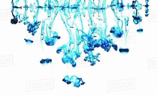 Blue ink dripping into water - Royalty-free Stock Photo | Dissolve