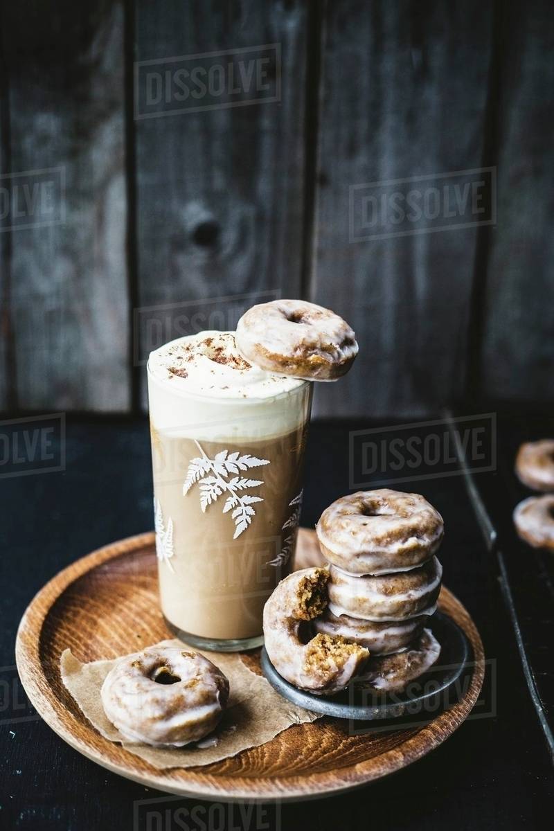 Squash doughnuts with spices, with a hot chocolate topped with cream ...