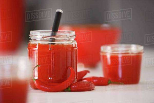 Pepper and chilli chutney in jars - Royalty-free Stock Photo | Dissolve