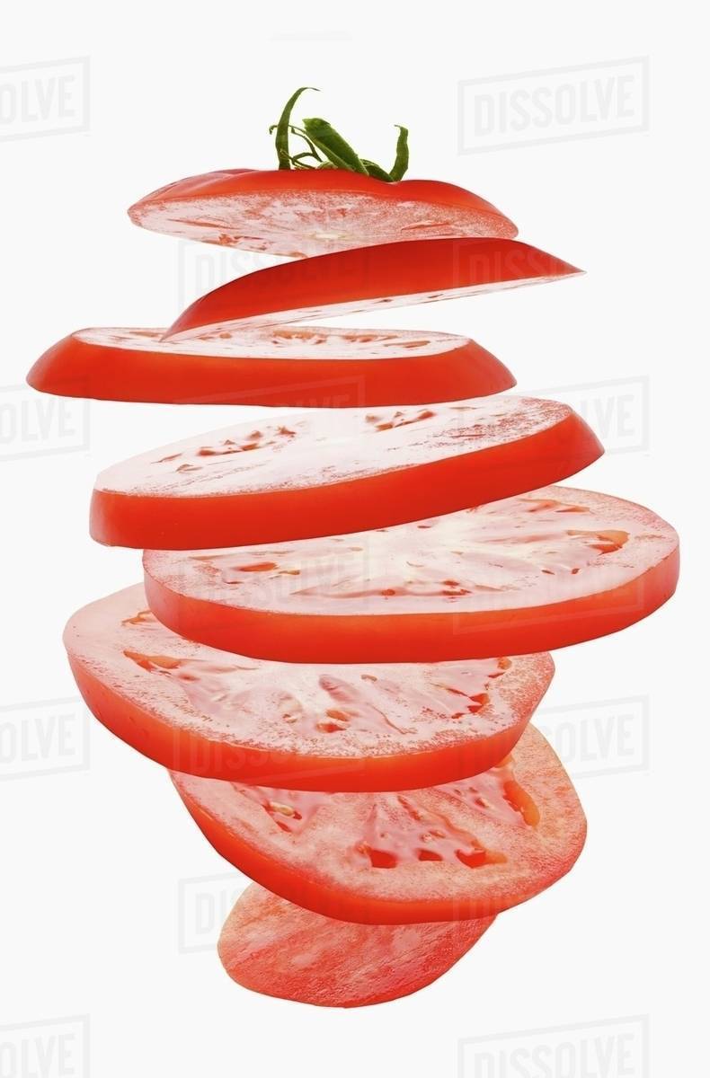 Flying tomato slices - Royalty-free Stock Photo | Dissolve