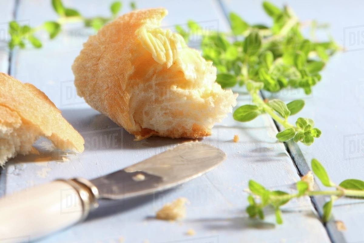 White bread spread with butter - Royalty-free Stock Photo | Dissolve