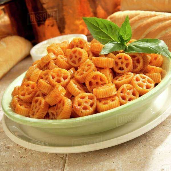 Wagon Wheel Pasta with Marinara Sauce - Stock Photo - Dissolve