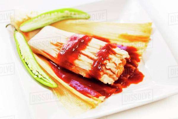 Spicy Tamale with Husk Peeled Open - Royalty-free Stock Photo | Dissolve