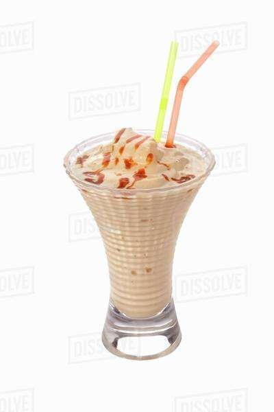 A caramel shake with two straws - Stock Photo - Dissolve