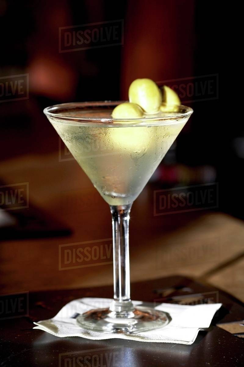 Martini with Green Olives; On a Cocktail Napkin - Royalty-free Stock ...