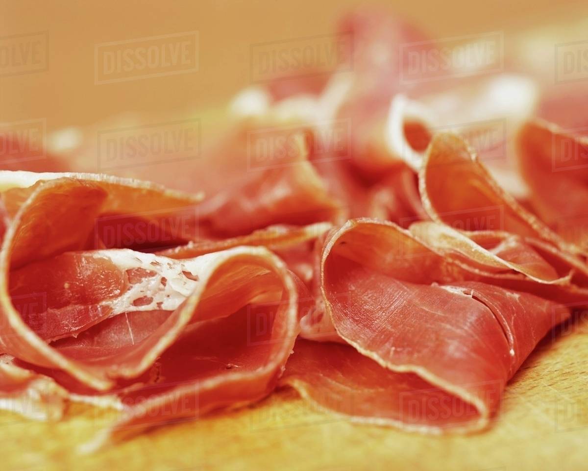 Various slices of raw ham (close-up) - Royalty-free Stock Photo | Dissolve