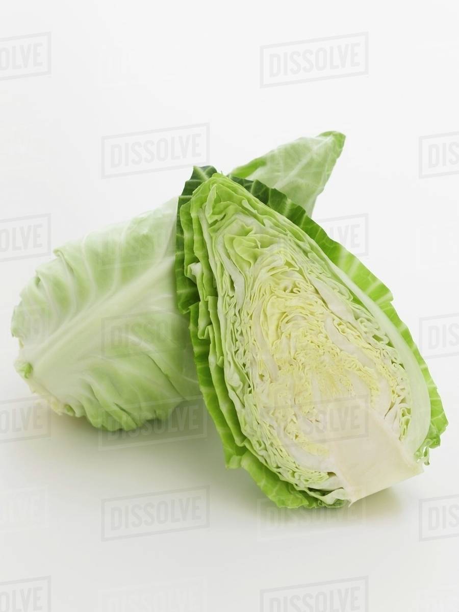 A pointed cabbage, cut in half - Royalty-free Stock Photo | Dissolve