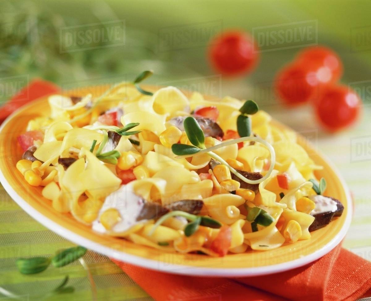 Ribbon pasta with sweetcorn and sprouts - Royalty-free Stock Photo ...
