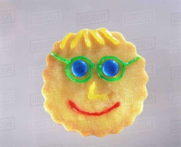 Decorated biscuit (boy's face) - Royalty-free Stock Photo | Dissolve