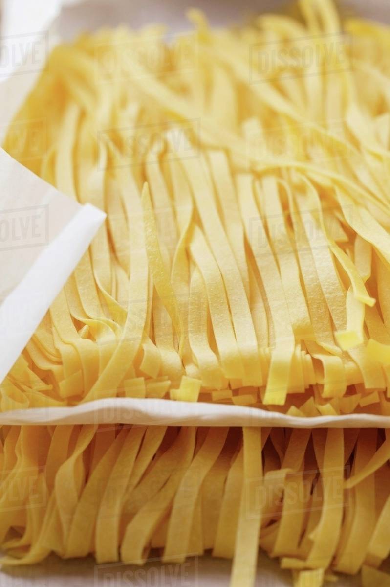 Ribbon pasta on paper - Royalty-free Stock Photo | Dissolve