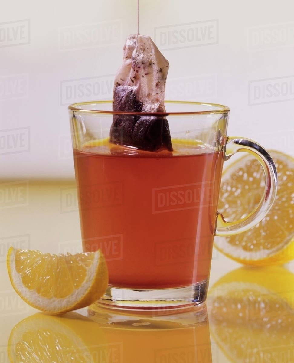 A glass of fruit tea with lemon - Royalty-free Stock Photo | Dissolve