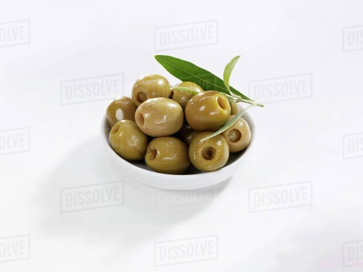 Green olives in a small bowl - Royalty-free Stock Photo | Dissolve