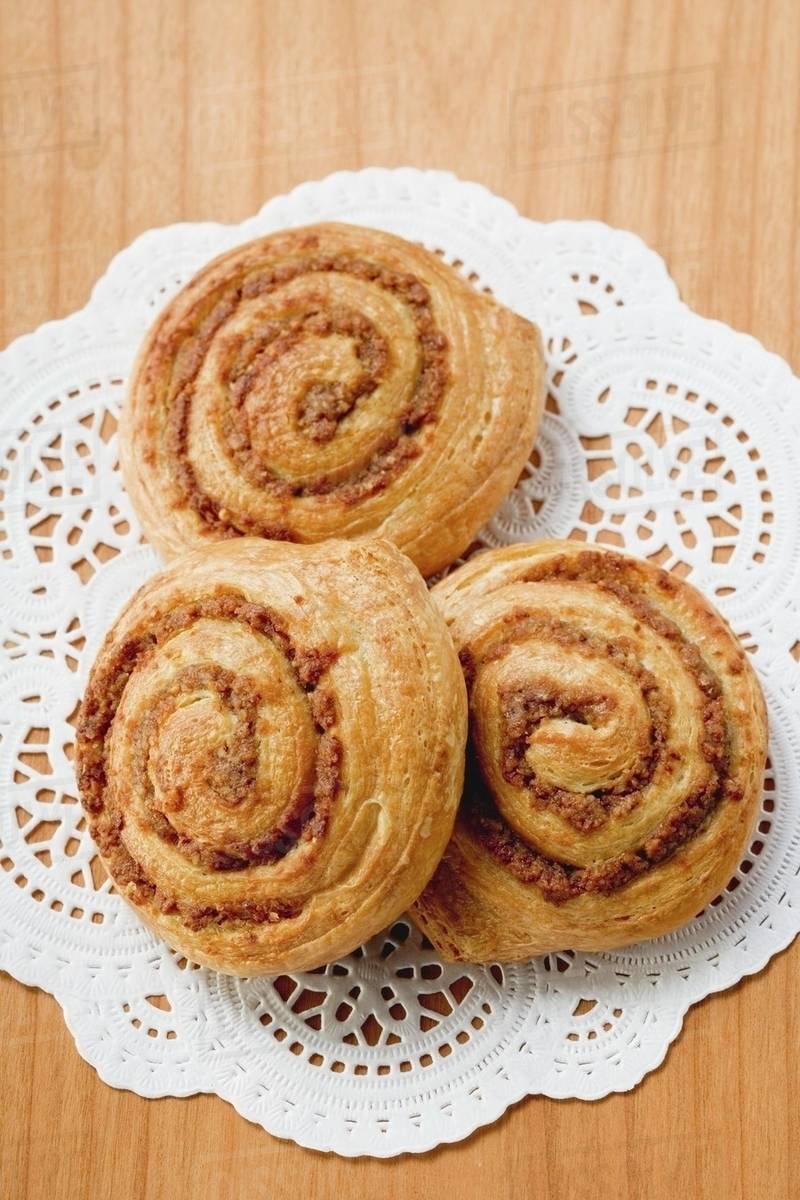 Three Danish pastry snails with nut filling - Royalty-free Stock Photo ...
