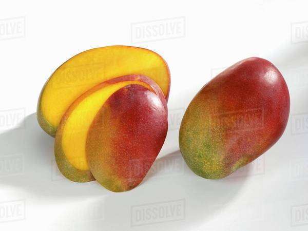 Whole and sliced mango - Royalty-free Stock Photo | Dissolve