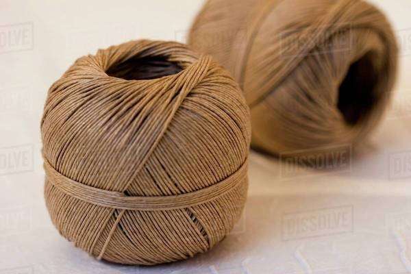Two balls of string - Stock Photo - Dissolve