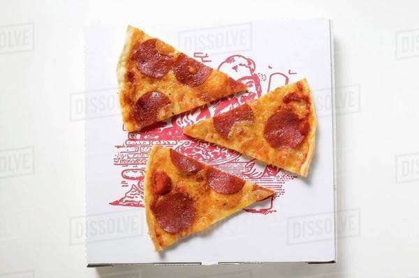Three slices of pepperoni pizza on pizza box - Royalty-free Stock Photo ...