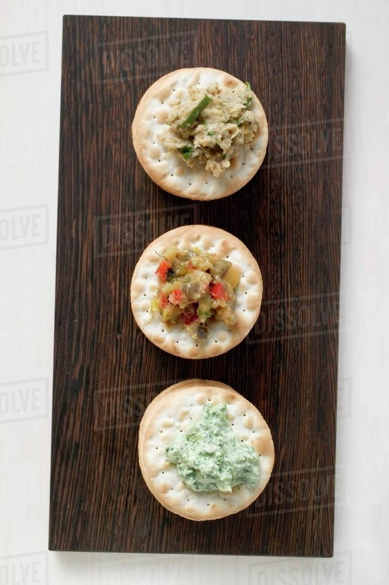 Crackers with three different spreads - Stock Photo - Dissolve