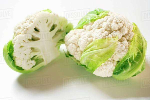 Whole and half cauliflower - Royalty-free Stock Photo | Dissolve