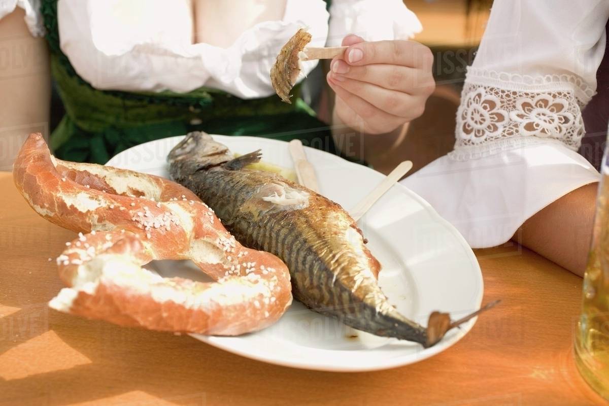 Steckerlfisch (fish on stick) & pretzel (Oktoberfest, Munich) - Stock ...