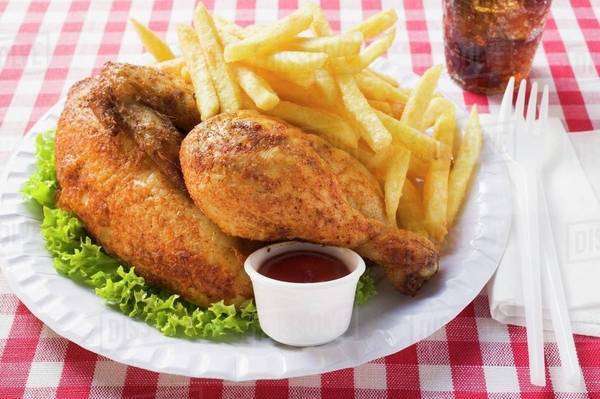 Half a roast chicken with chips on paper plate - Royalty-free Stock ...