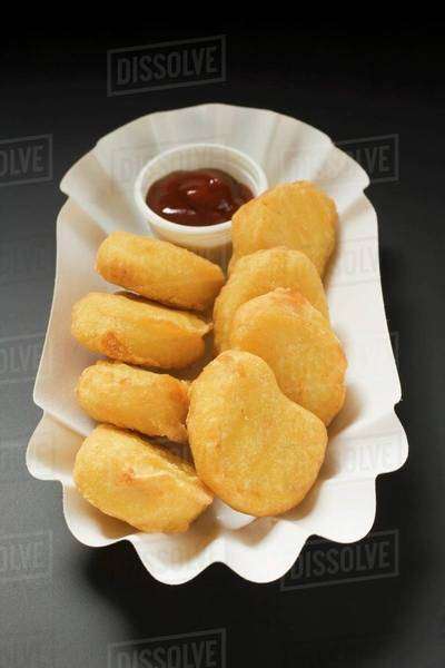 Chicken nuggets with dip in paper dish - Royalty-free Stock Photo ...