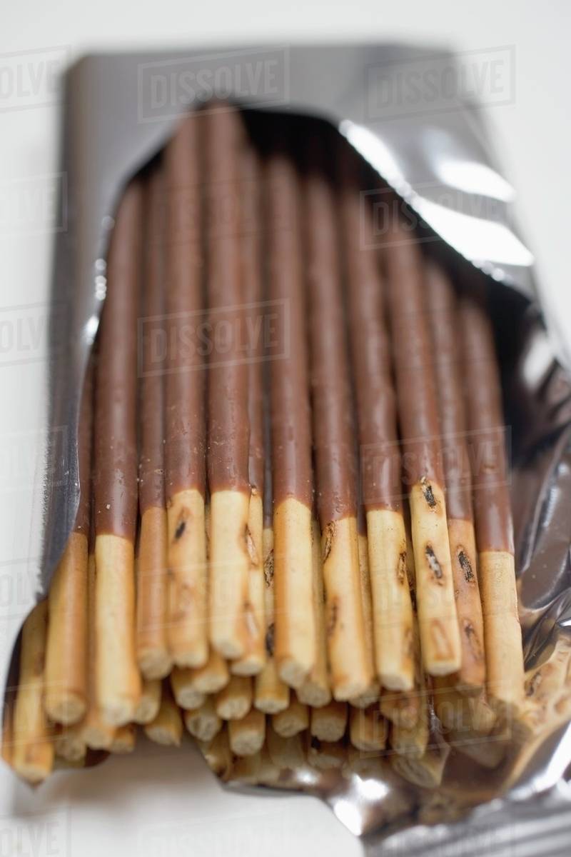 Chocolate sticks in opened packaging - Stock Photo - Dissolve