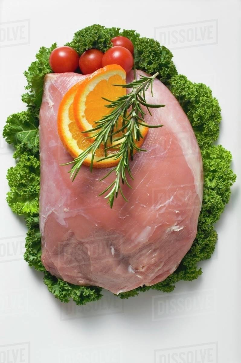 Fresh pork with garnish - Royalty-free Stock Photo | Dissolve