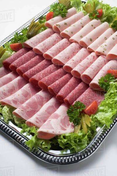 Attractively arranged cold cuts platter - Stock Photo - Dissolve