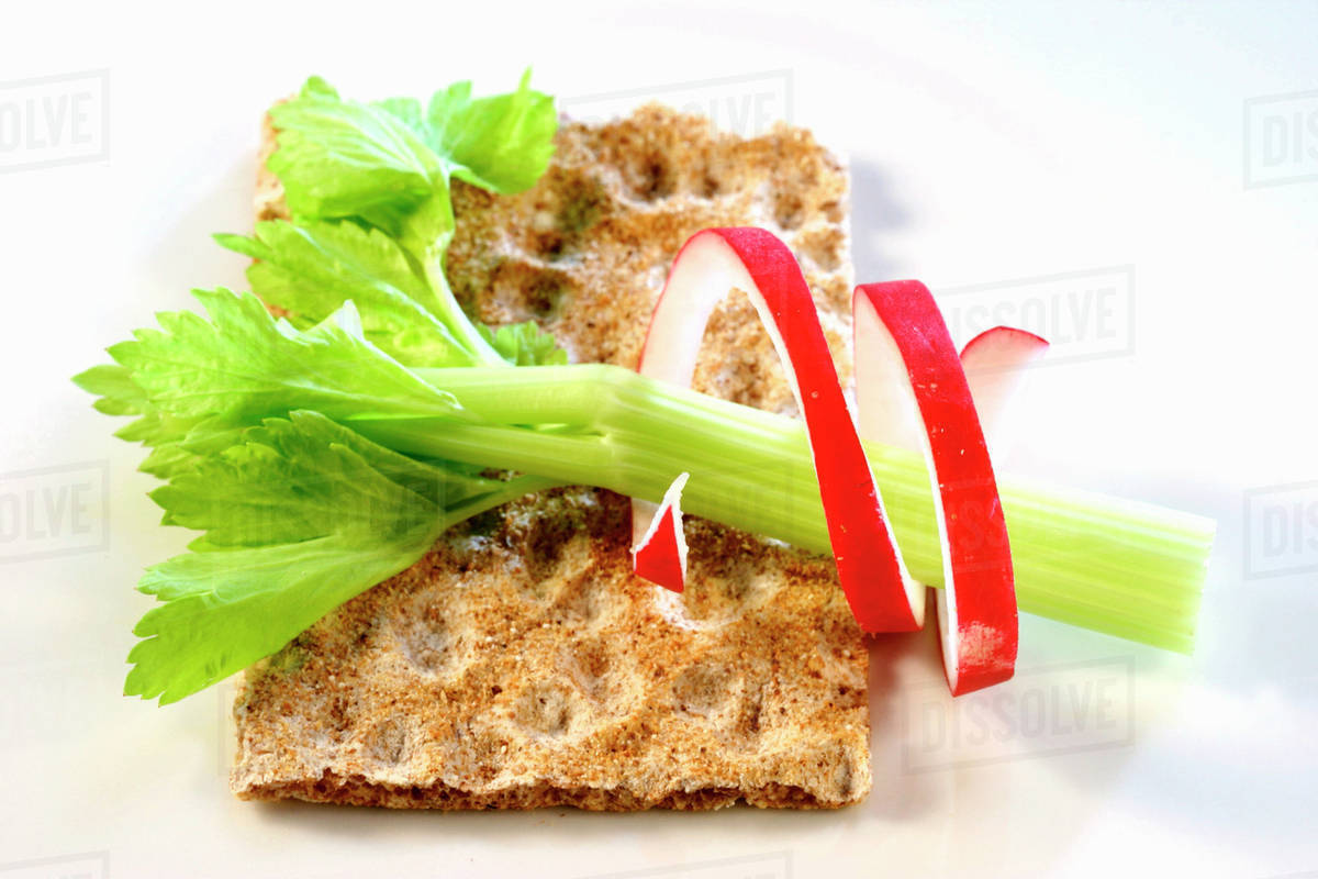 Crispbread with celery and radishes - Royalty-free Stock Photo | Dissolve