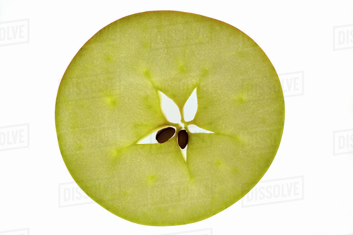 Slice of apple (cross-section), backlit - Royalty-free Stock Photo ...