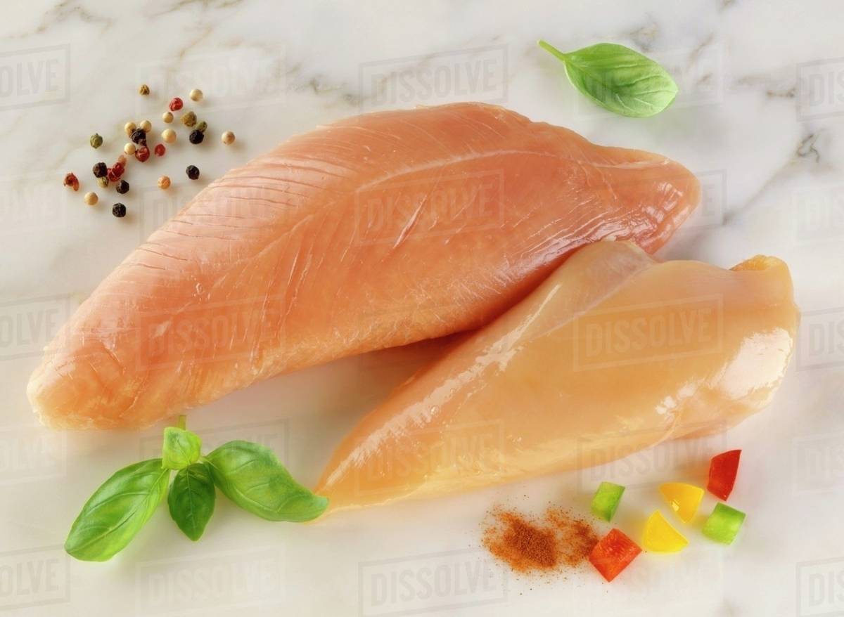 Two pieces of turkey fillet - Stock Photo - Dissolve