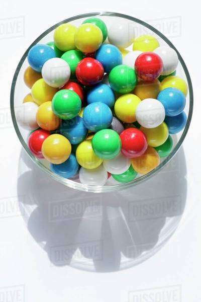 Lots of coloured chewing gum balls in a glass bowl - Royalty-free Stock ...